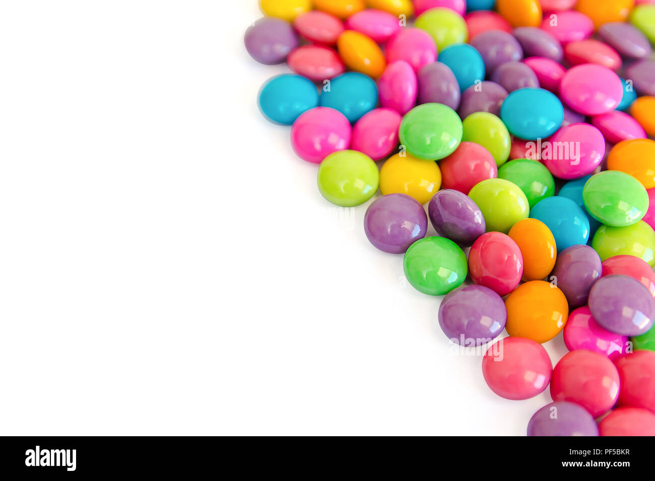 colorful chocolate coated candy isolated on white background. with copy ...