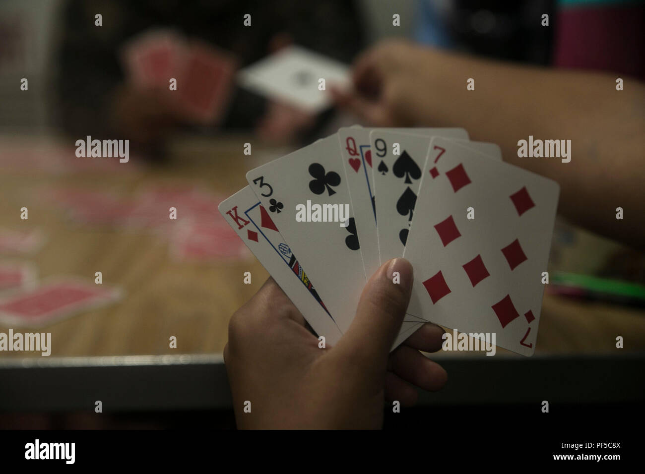 Marines with the 31st Marine Expeditionary Unit play a game of go-fish ...