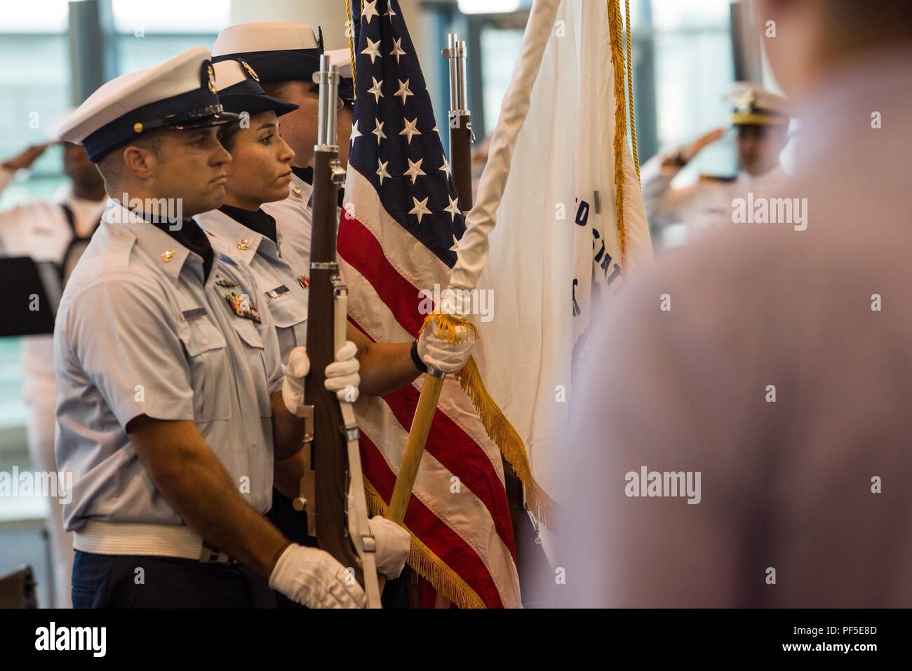 Coast Guard color guard present the national and Coast Guard flags ...