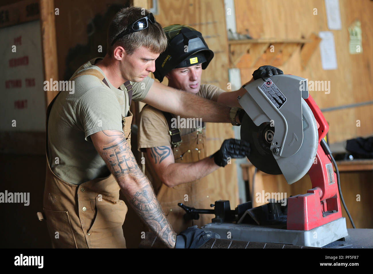 U.S. Navy EO3 Beau Schramm (left) and SW3 Jonathan Rowe (right), Naval ...
