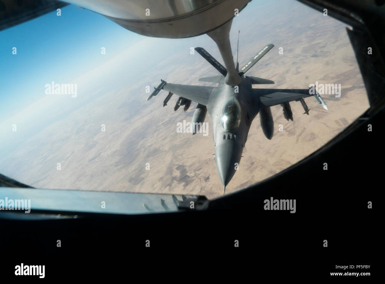 A U.S. Air Force F-16 Fighting Falcon steadies itself as it receives in ...