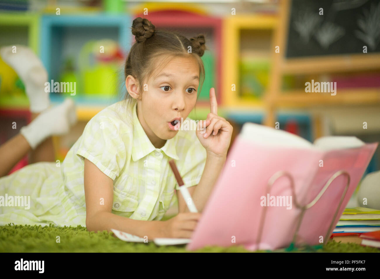 Close up portrait of schoolgirl doing homework Stock Photo - Alamy