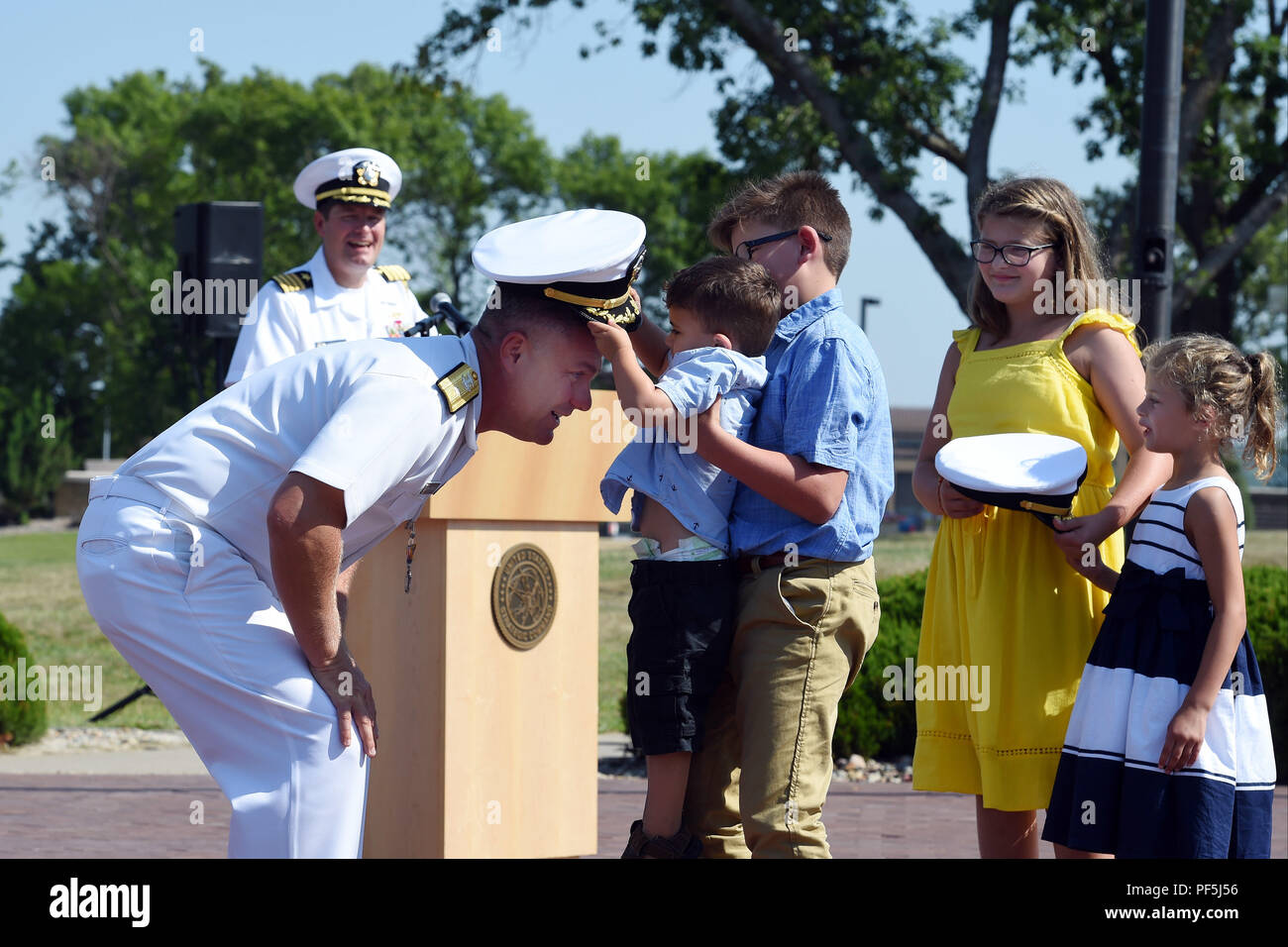 U.S. Navy Rear Adm. John Spencer's sons remove his old combination ...
