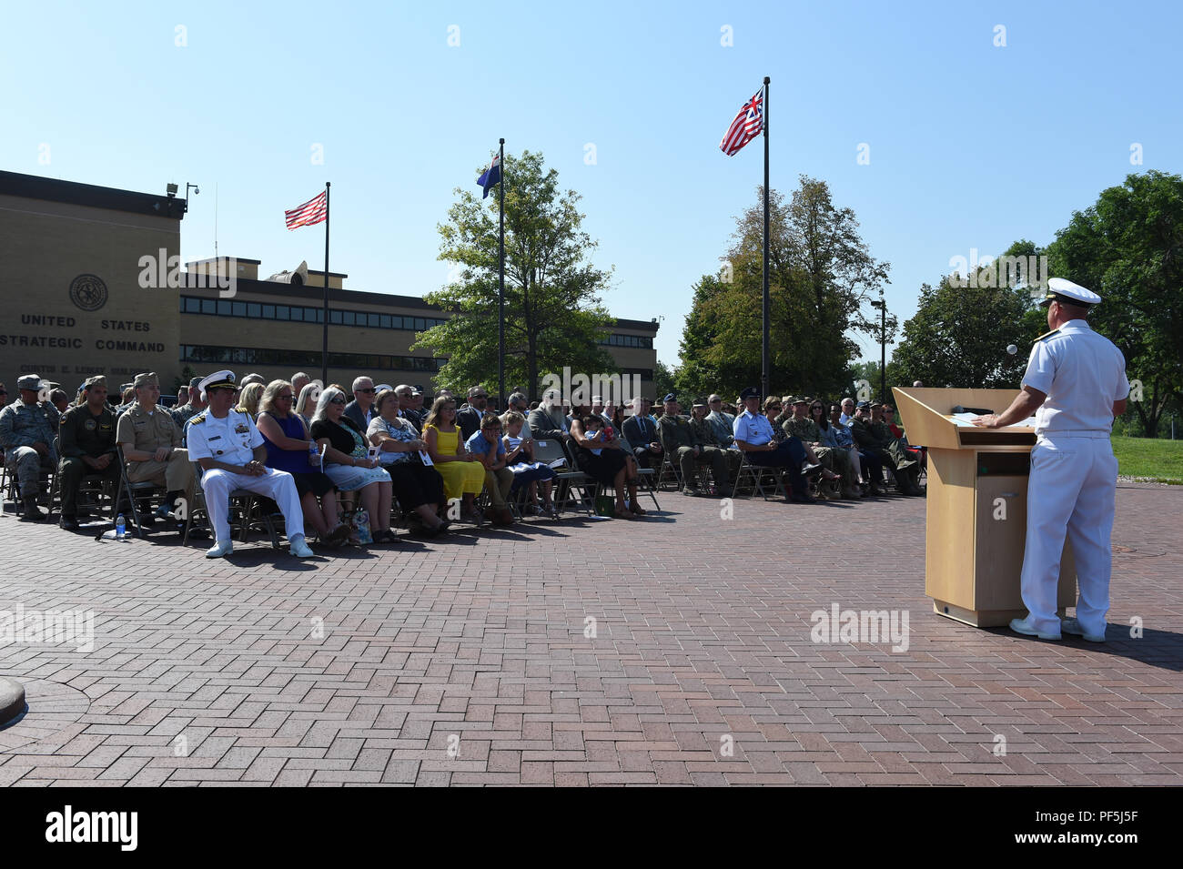 U.S. Navy Rear Adm. John Spencer provides remarks following his ...