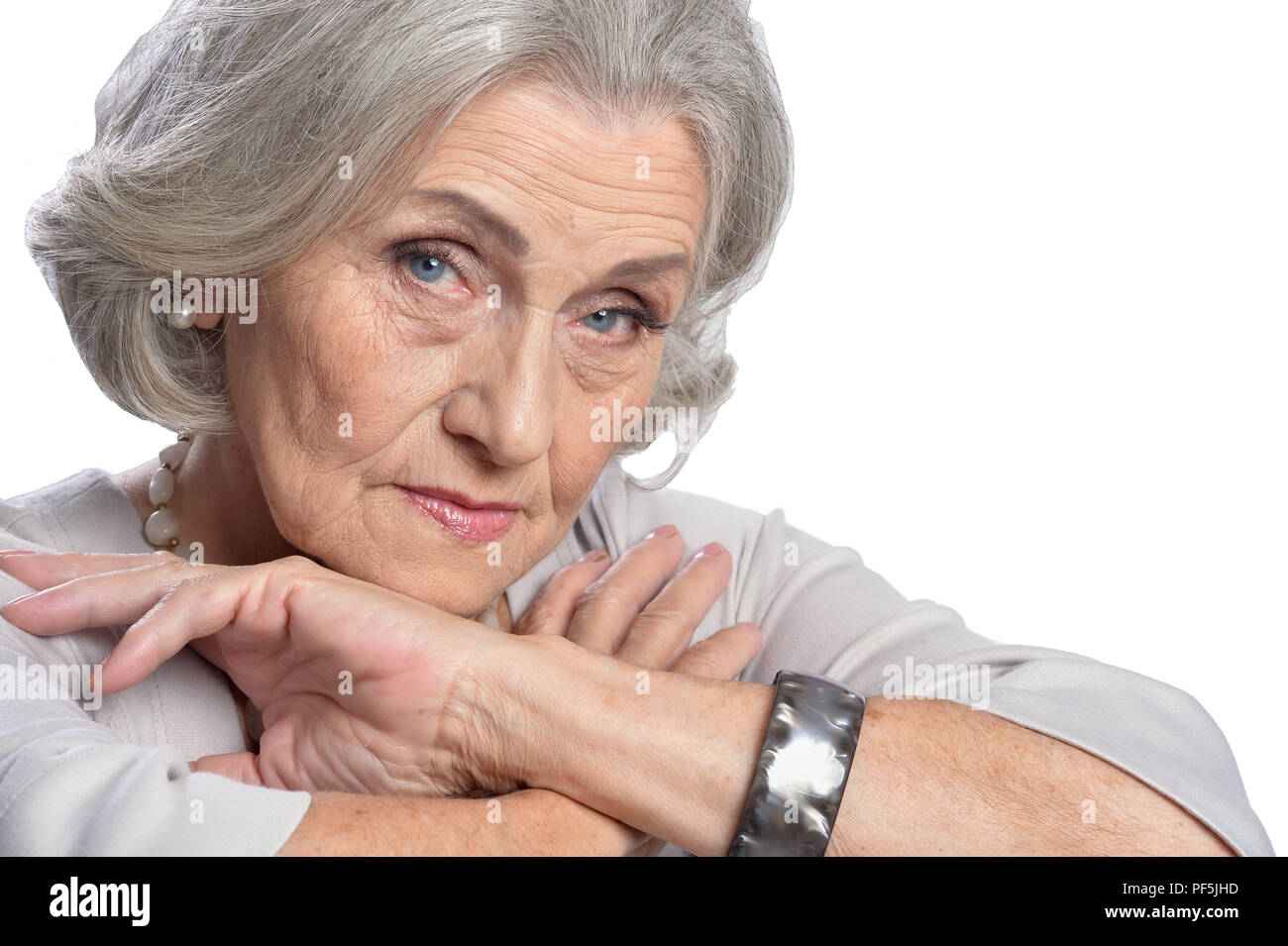 Portrait of a beautiful senior woman posing Stock Photo - Alamy