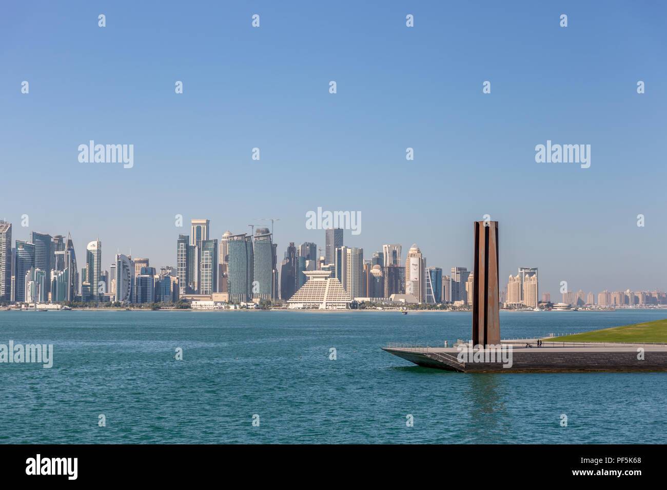 The skyline of Doha, Qatar, on a blue sky day, winter time, seen from ...