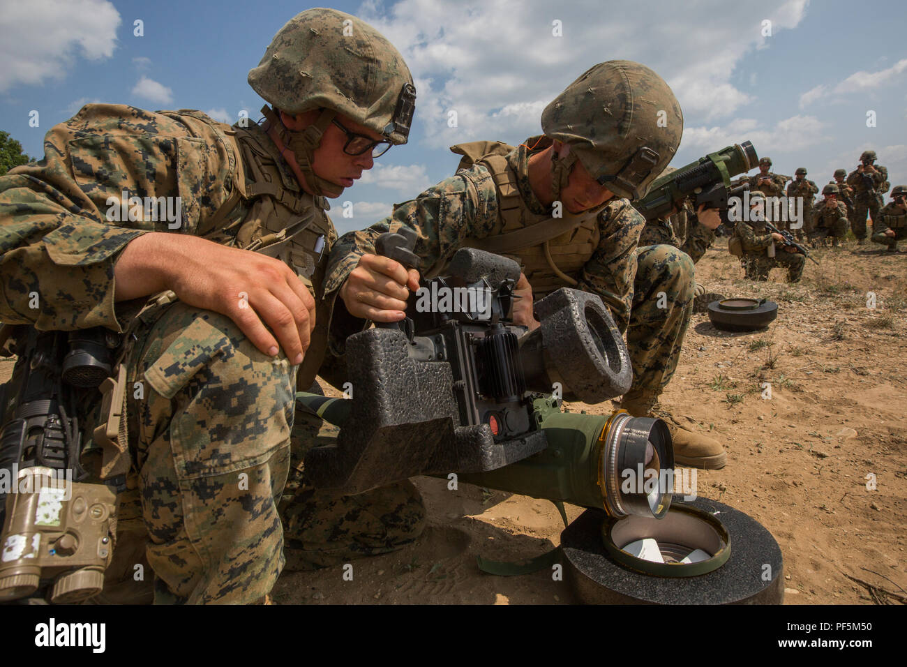Marines with Weapons Company, 3rd Battalion, 25th Marine Regiment, load ...