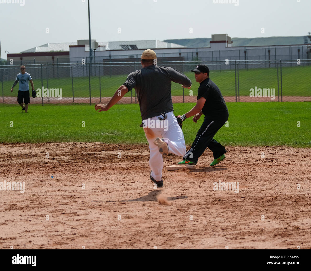 A Soldier sprints for second base during Ivy Week 2018 at Fort Carson ...