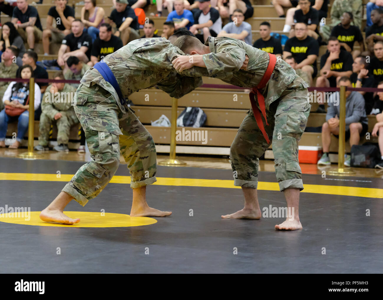 Two Soldiers compete in day 1 of the combatives tournament during Ivy ...