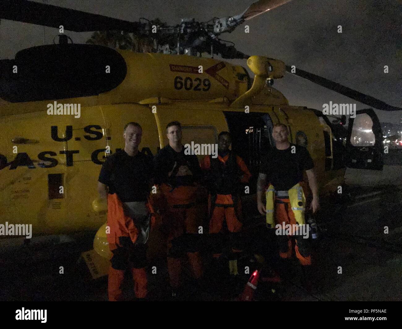 A Coast Guard MH-60 Jayhawk helicopter crew poses for a photo upon ...