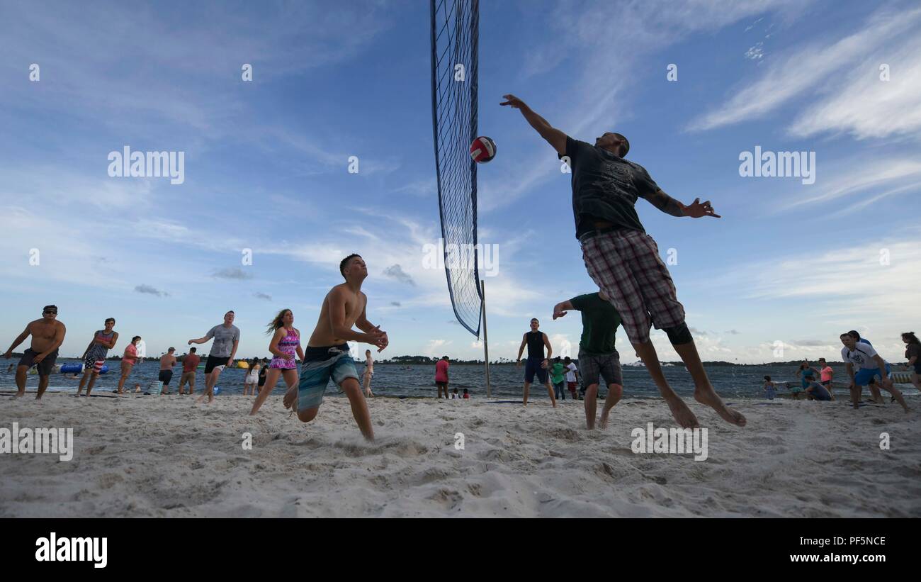 Air Commandos and families play volleyball during Beach Bash at ...