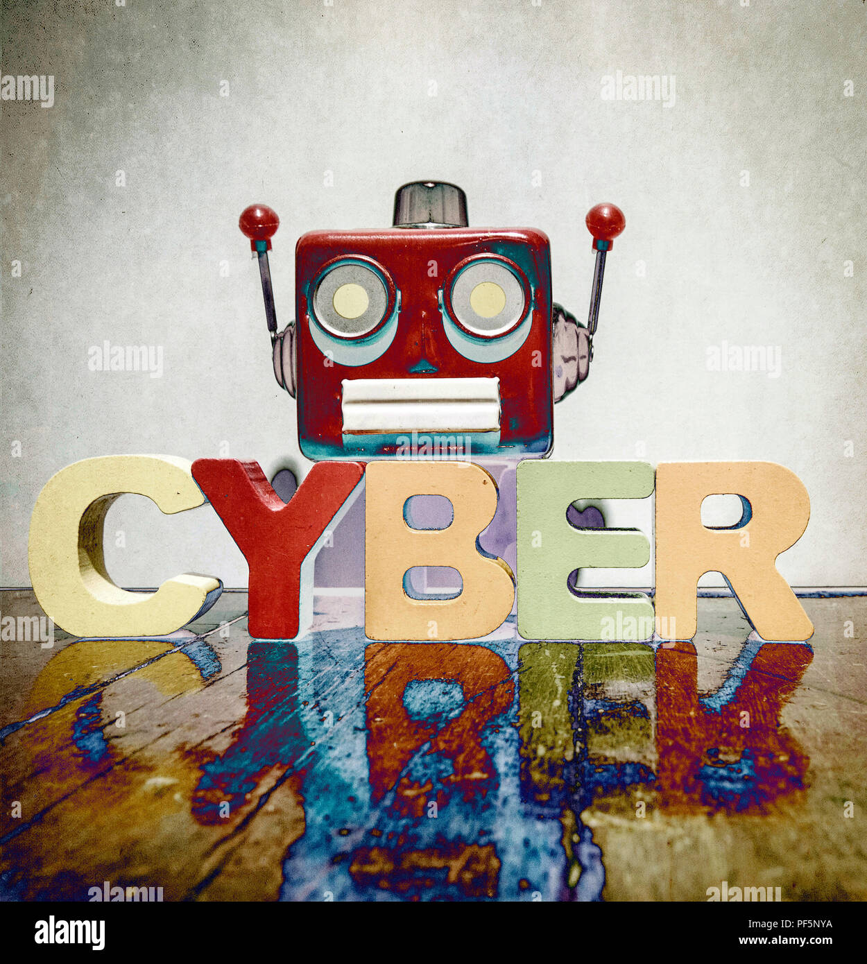 red retro robot head on the word CYBER on old wooden flor Stock Photo ...