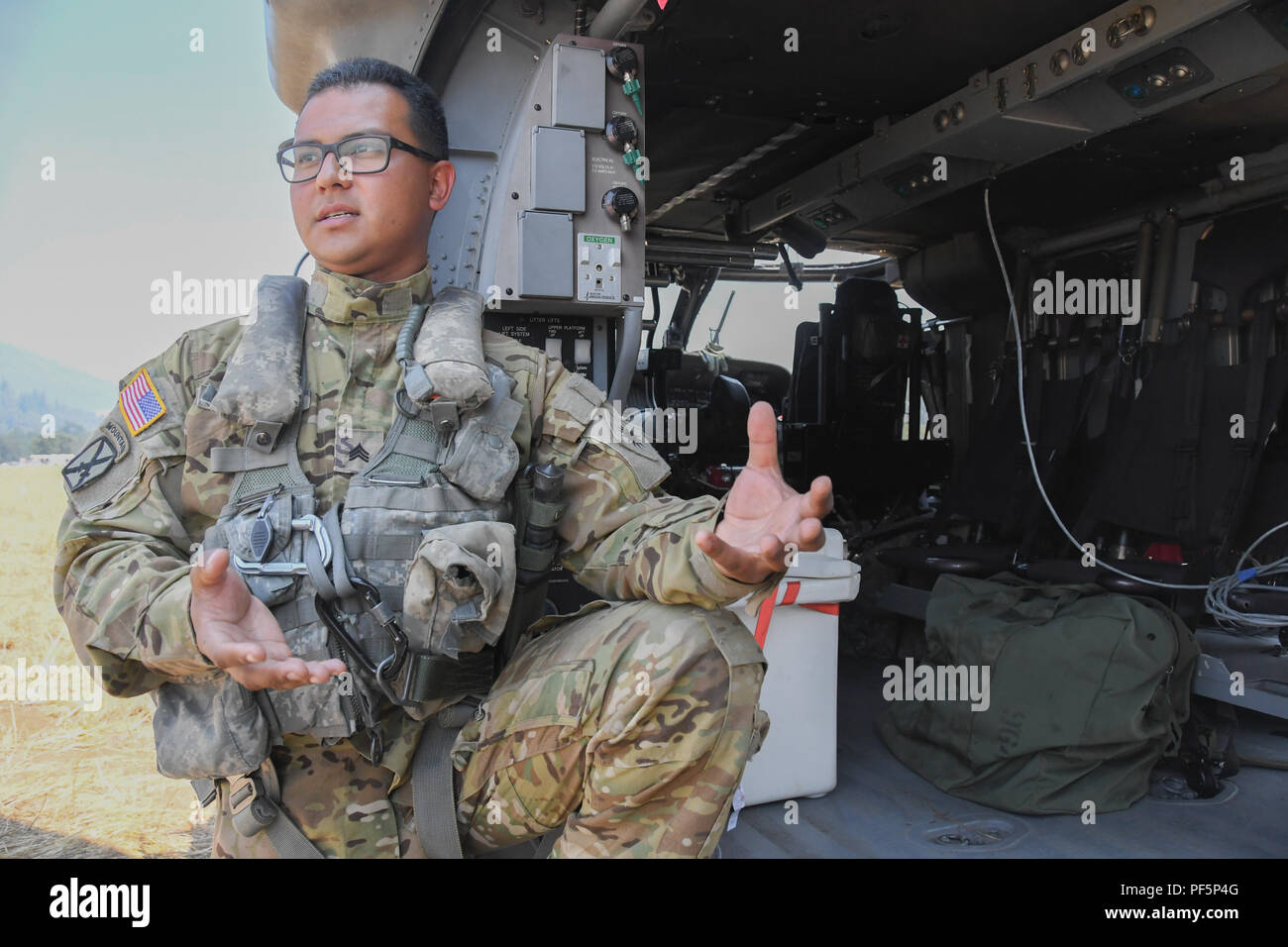Crew chief Sgt. Bryan Salazar presents the HH-60M Medevac Black Hawk at ...