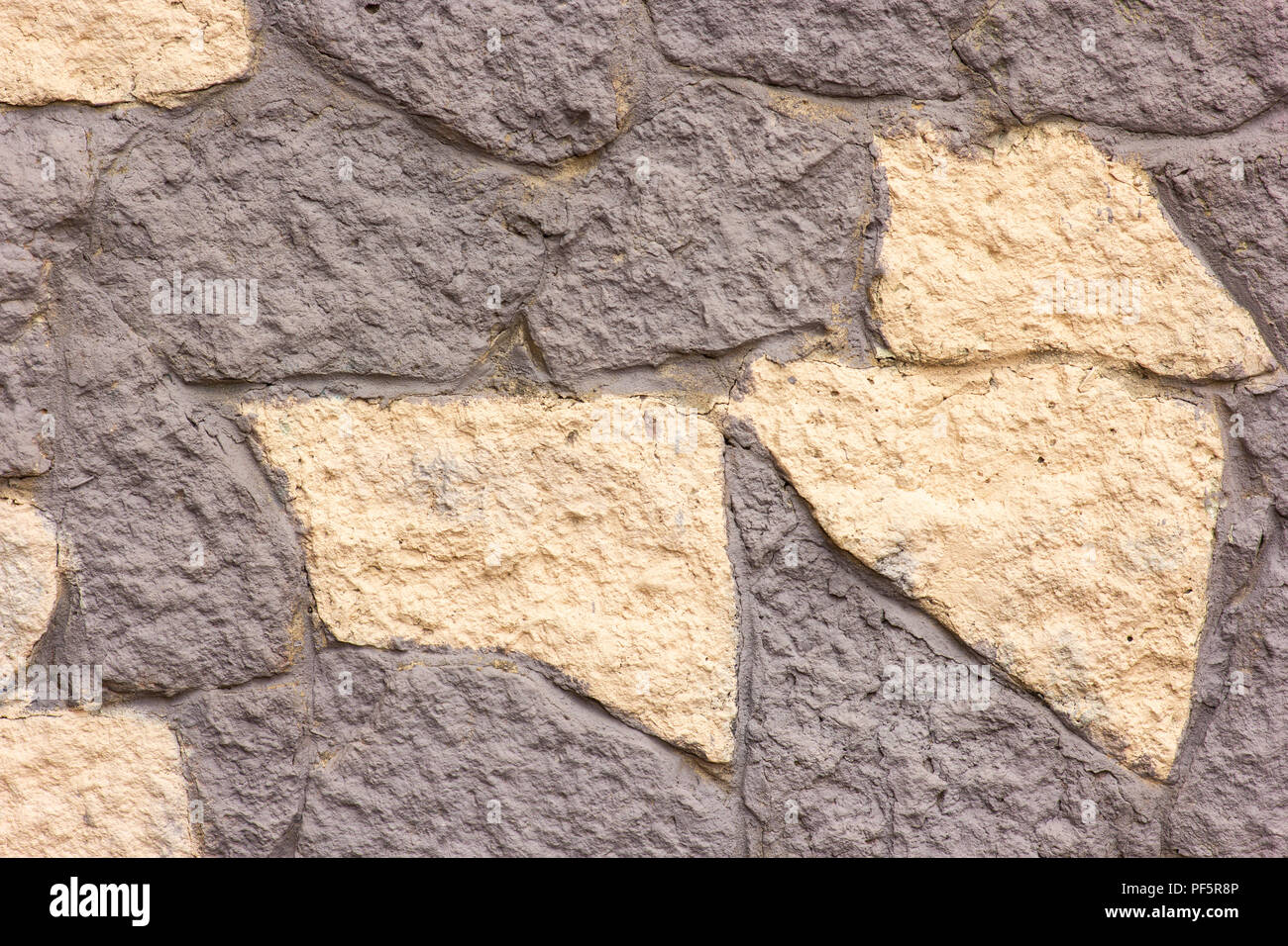 old stone wall background in multi-colored plaster Stock Photo - Alamy