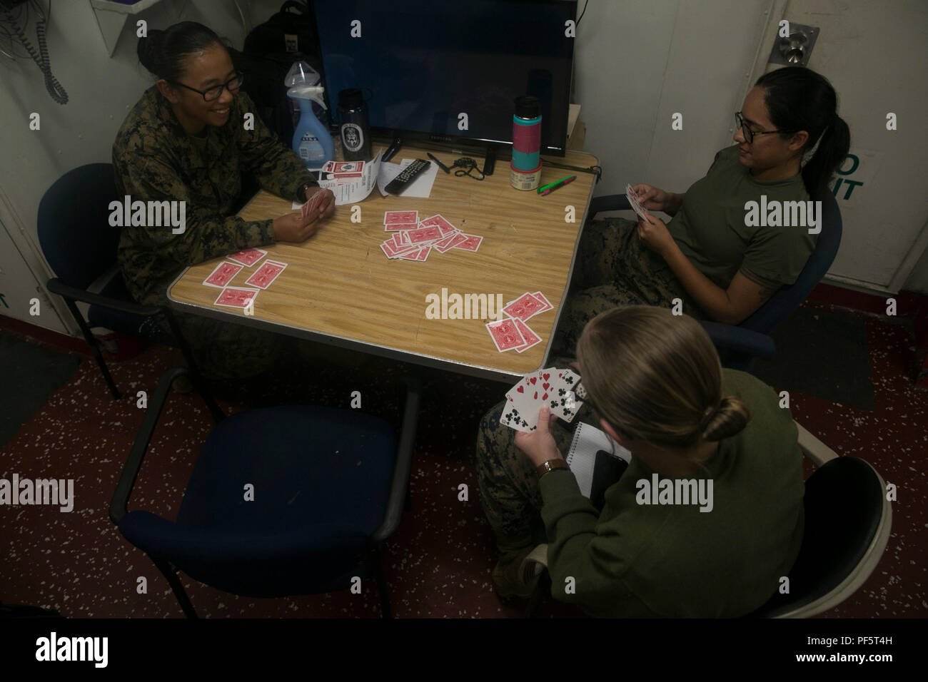 Marines with the 31st Marine Expeditionary Unit play a game of go-fish ...
