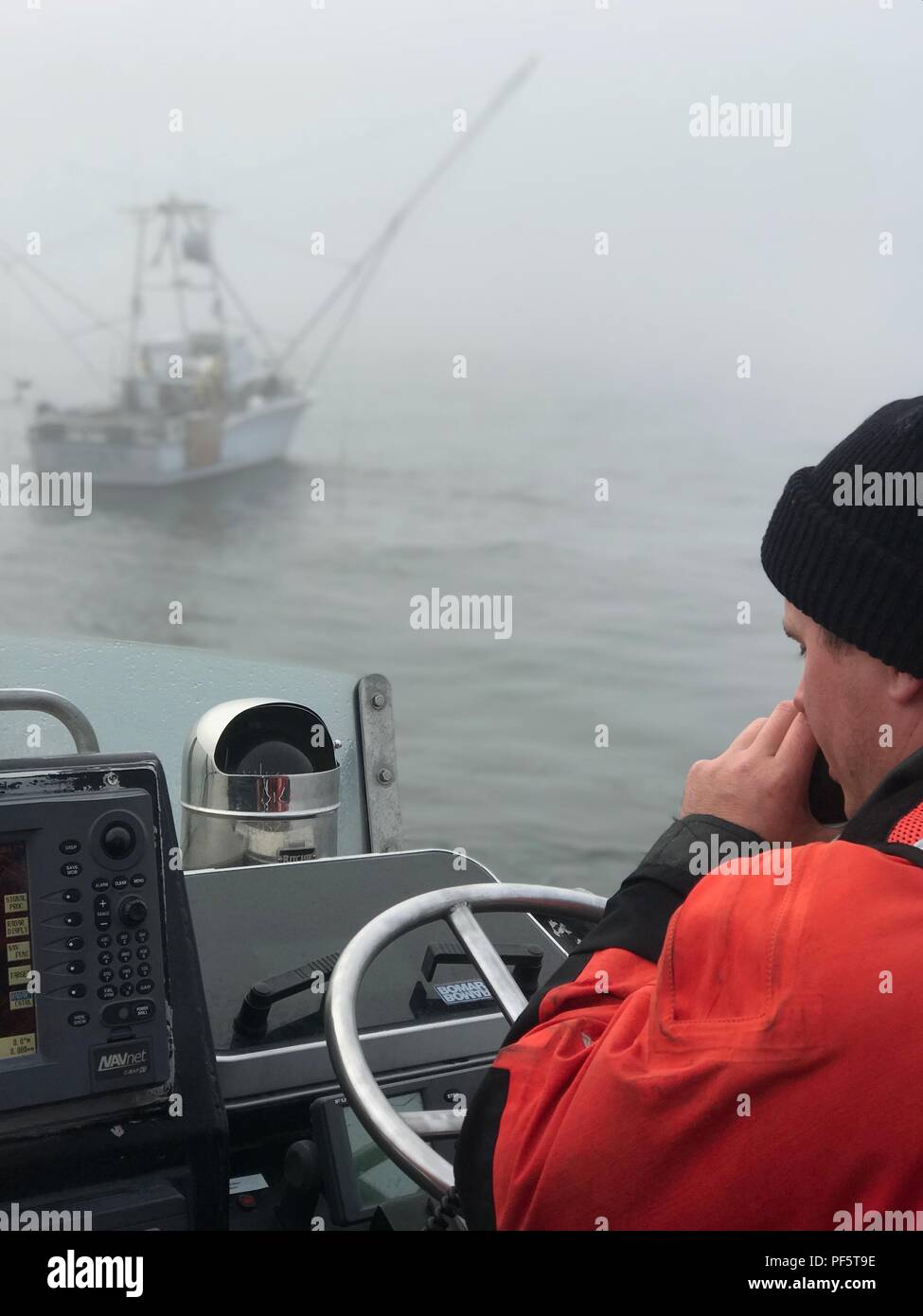 A Coast Guard Station Bodega Bay 47-foot Motor Lifeboat crew escorts a ...