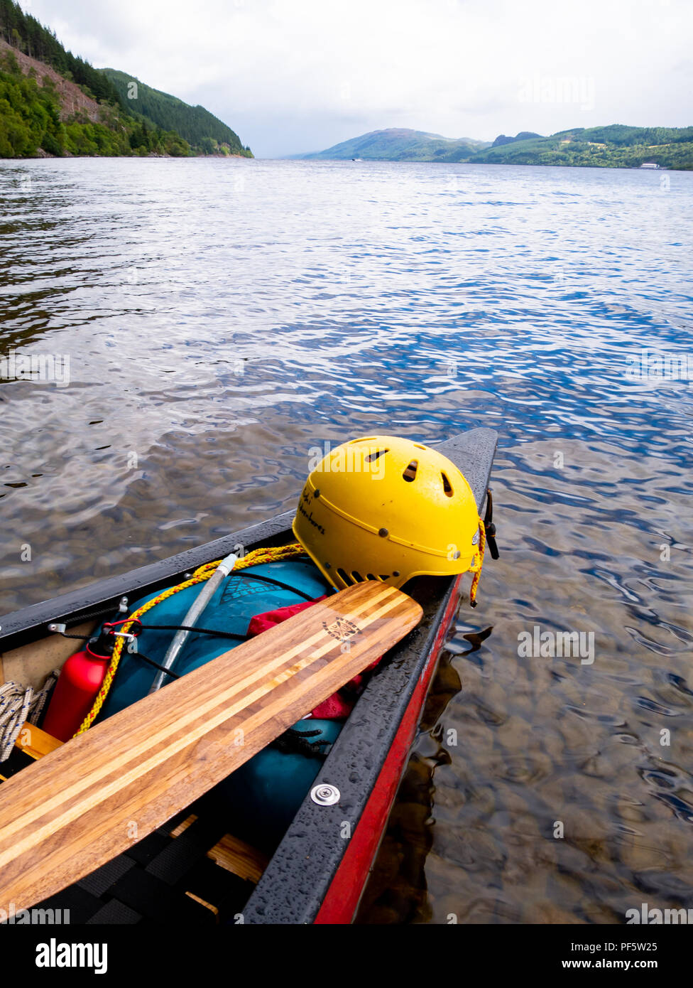 Canoe on the shore of Loch Ness, Scotland, UK, with wooden paddle and ...