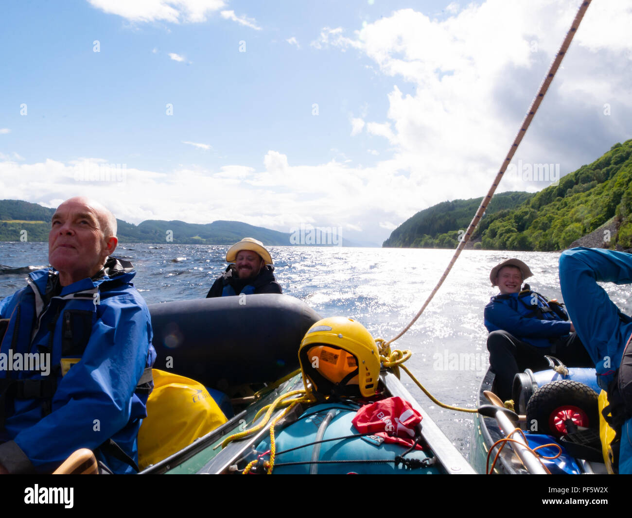 Group of friends canoe sailing on Loch Ness, Scotland, UK Stock Photo ...