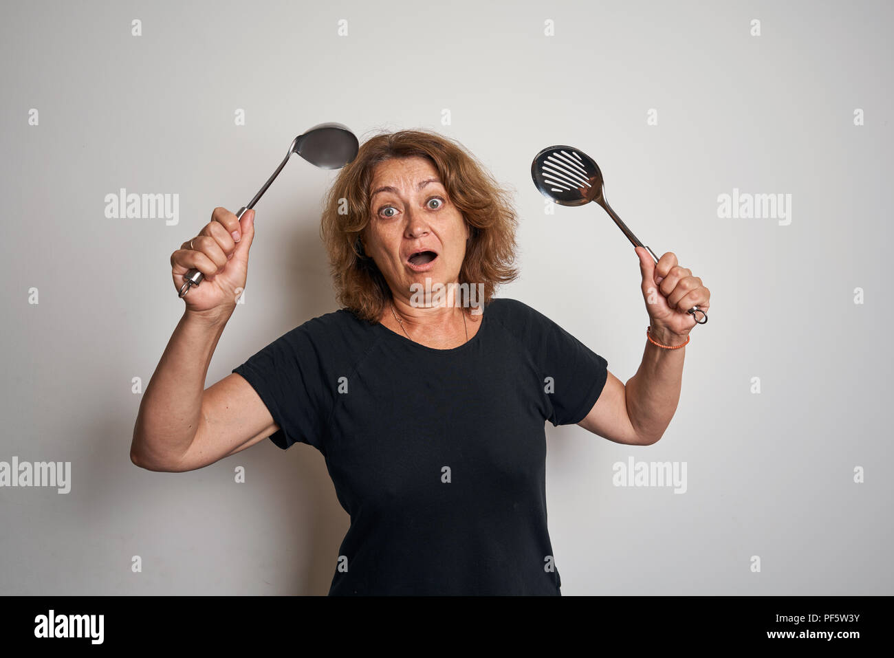 woman with the ladle on white background Stock Photo - Alamy