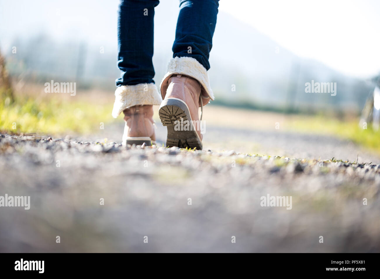 Low angle ground level view with shallow dof of the feet of a woman in ...