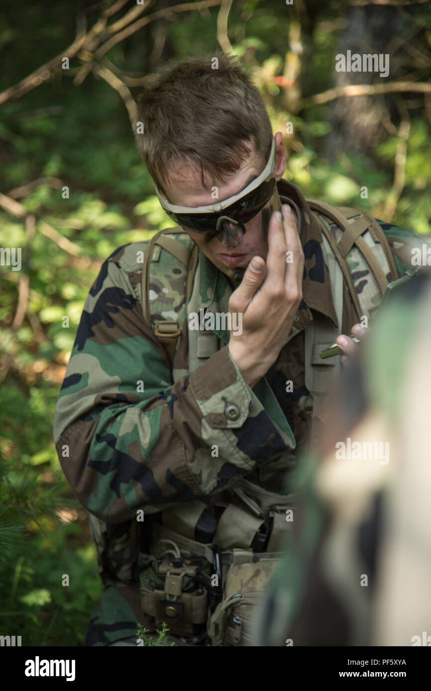 U.S. Army Sgt. Tyler Adams, 515th Sapper Company, applies face ...