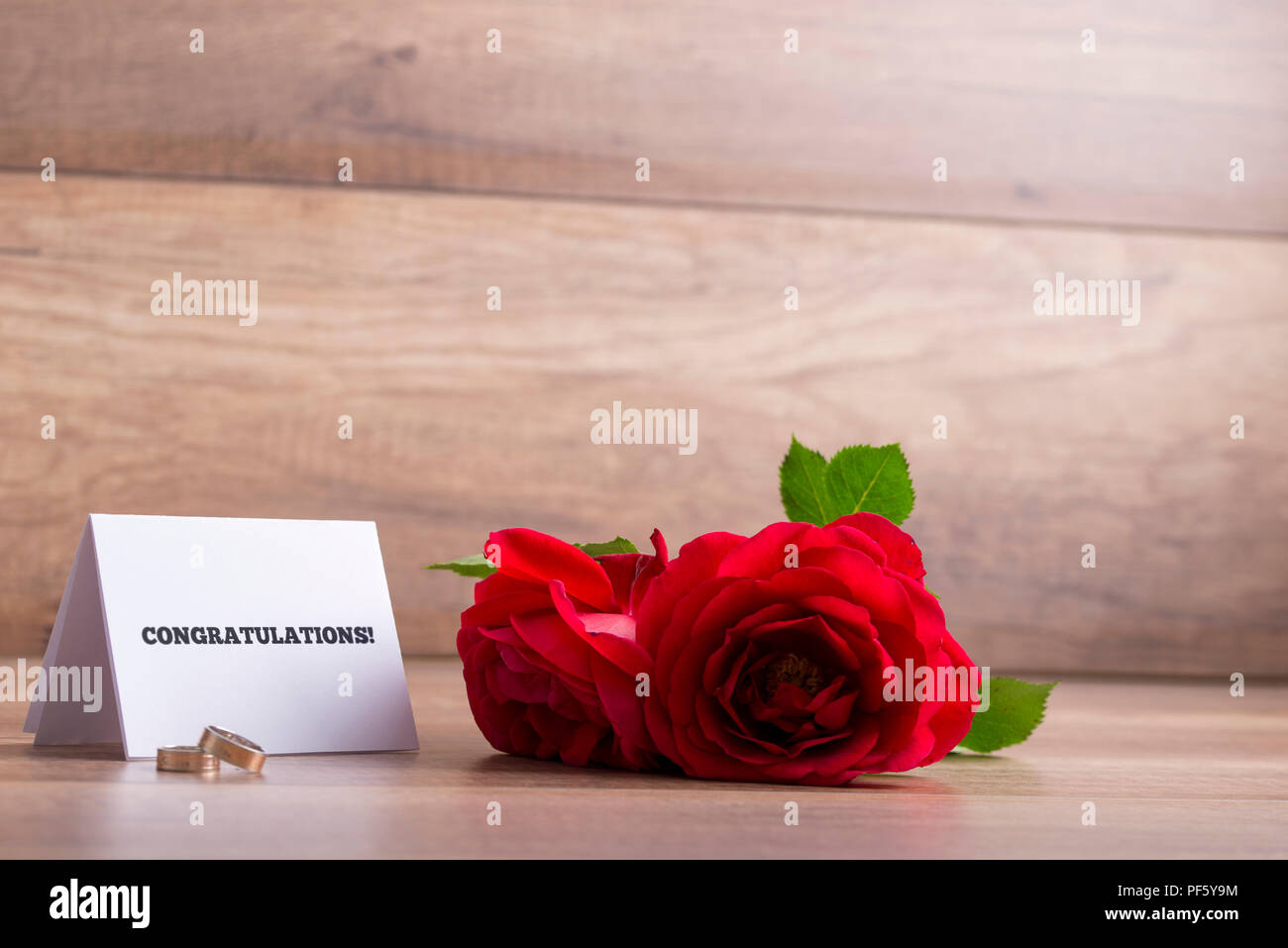 Wedding greetings - White card with Congratulations sign, wedding rings ...