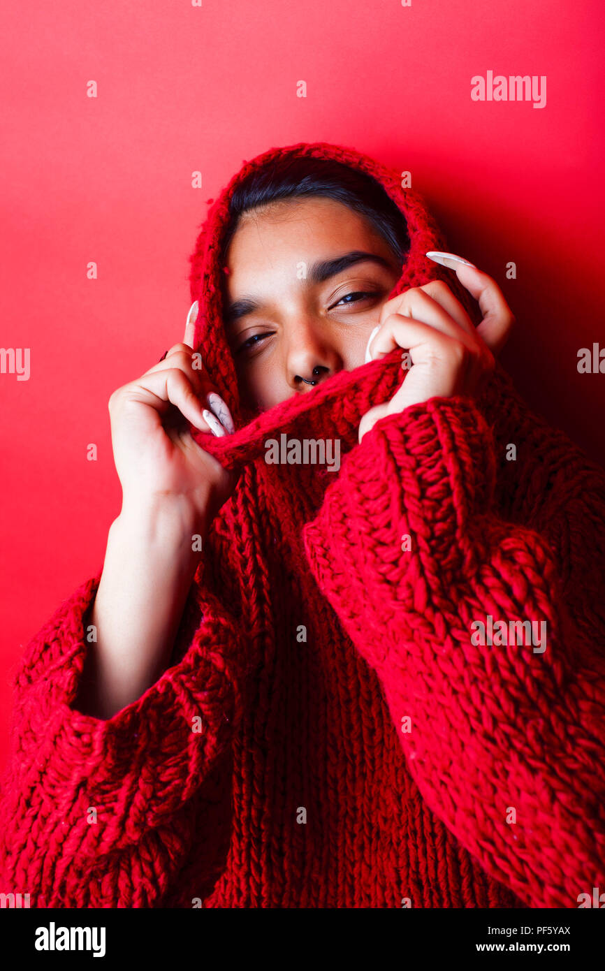 young pretty indian mulatto girl in red sweater posing emotional Stock ...