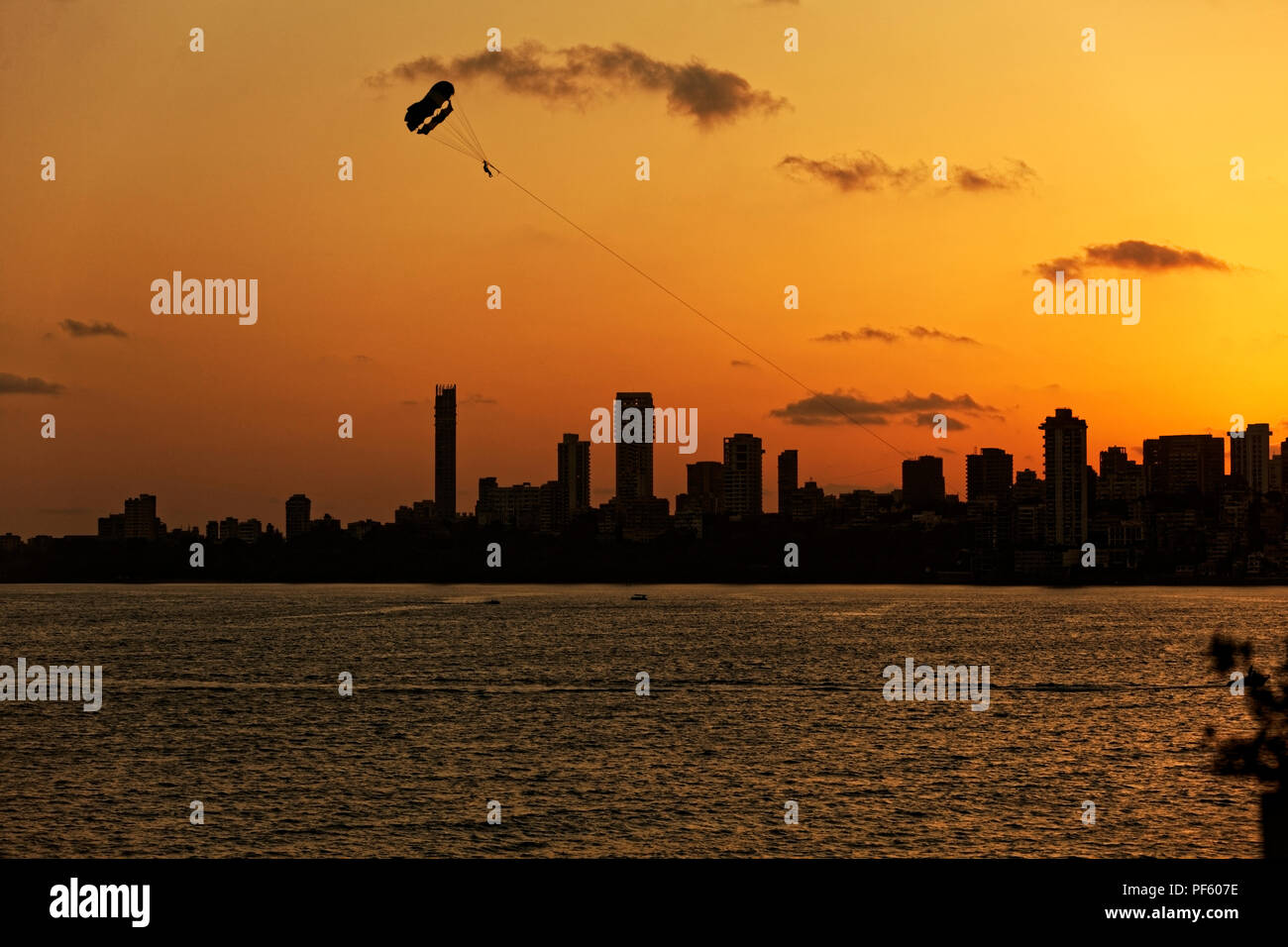 Skyline showing Walkeshwar area at sunset from marine drive in Mumbai ...