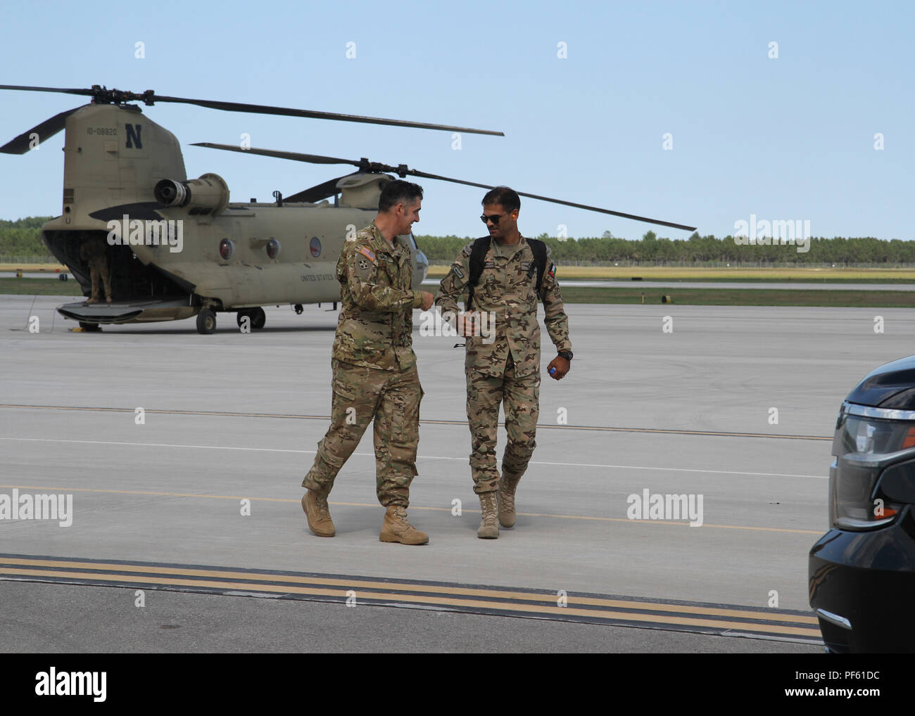 U.S. Army Capt. Sean Miller (left), Detachment 1 commander, Company B ...