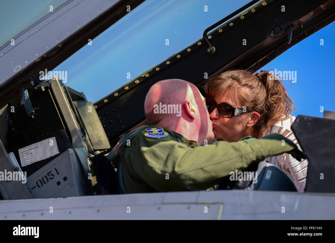 Col. Troy Endicott, 460th Space Wing commander, kisses his wife Tammy ...