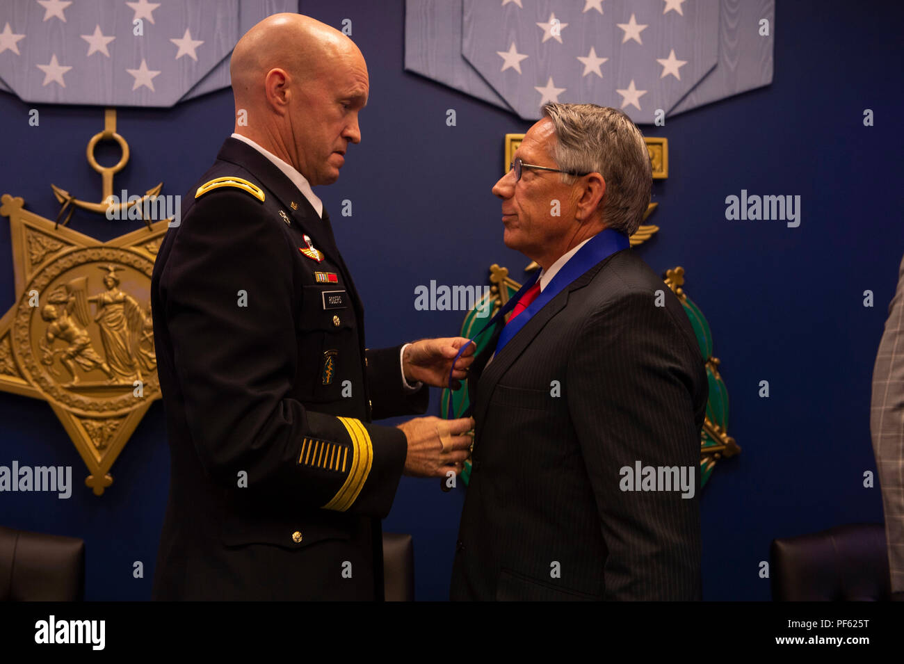 William T. Nix, right, is presented with the Medal of Valor by Army Lt ...