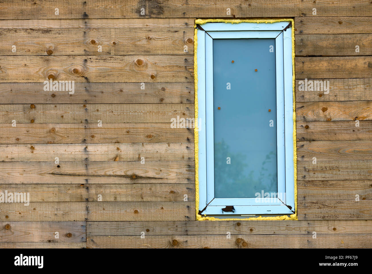 Close-up detail of new narrow plastic vinyl window installed in house ...