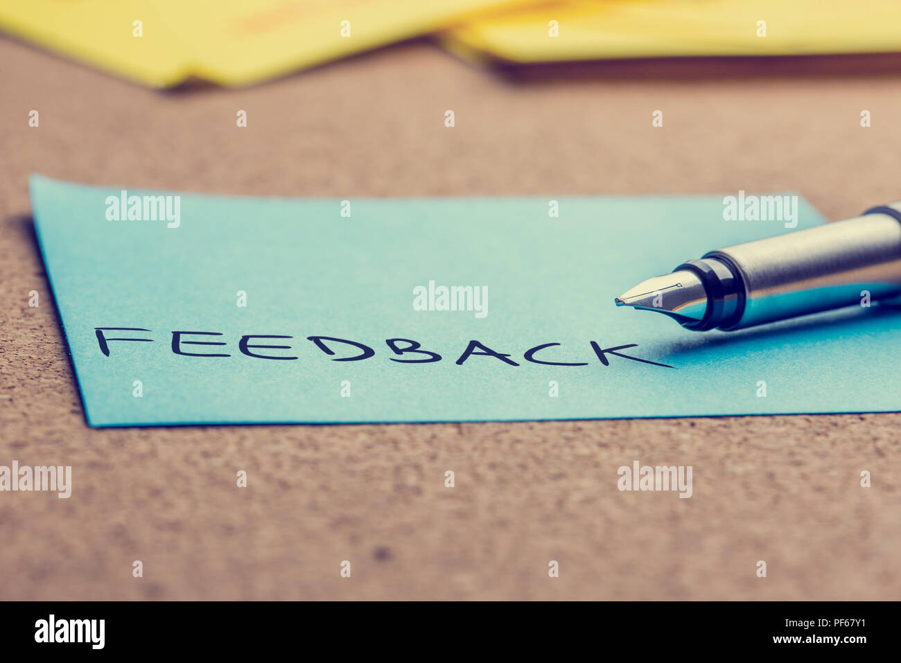 Close Up of Feedback Written on Blue Note with Pen, Vintage Effect ...