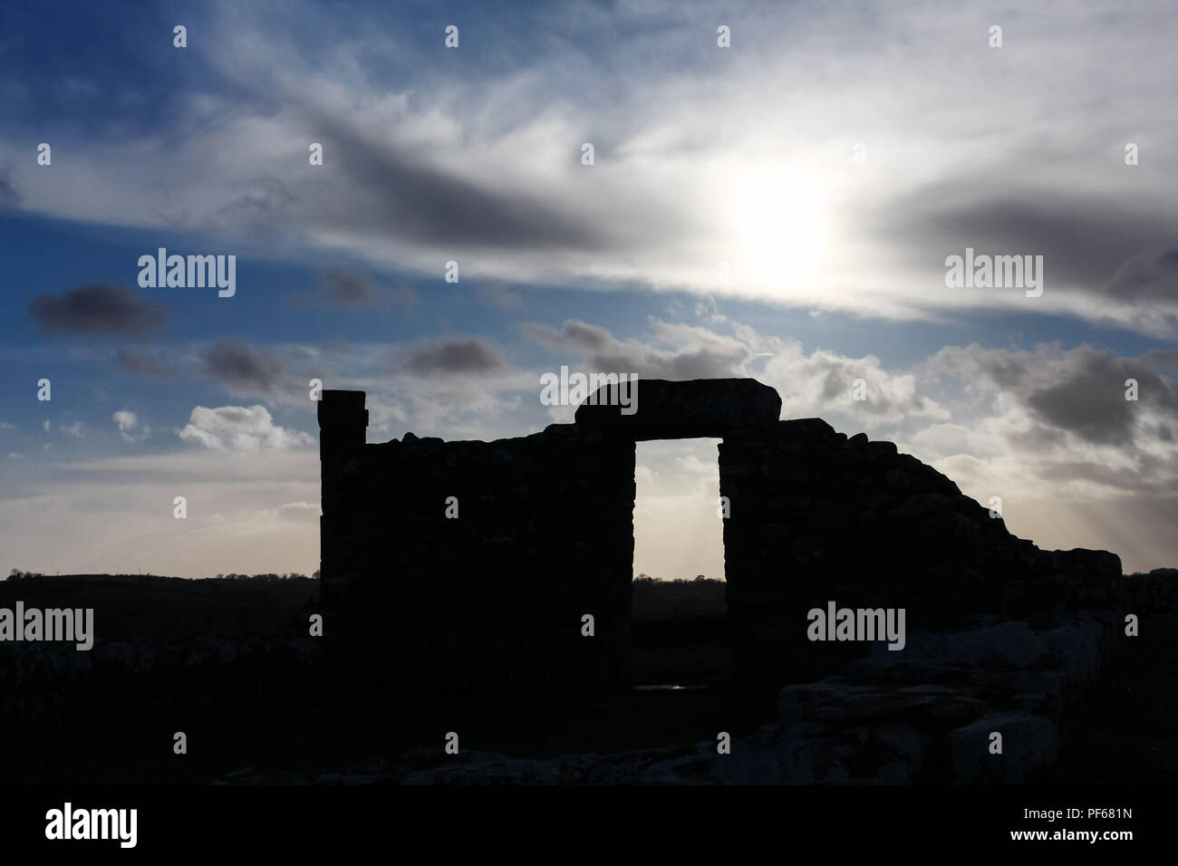 Skyscape with silhouette of old ruins of Nendrum Monastry, Mahee Island ...