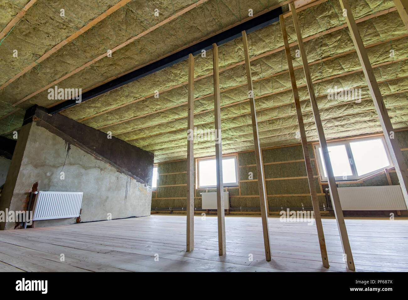 Construction and renovation of big light spacious empty room with oak ...