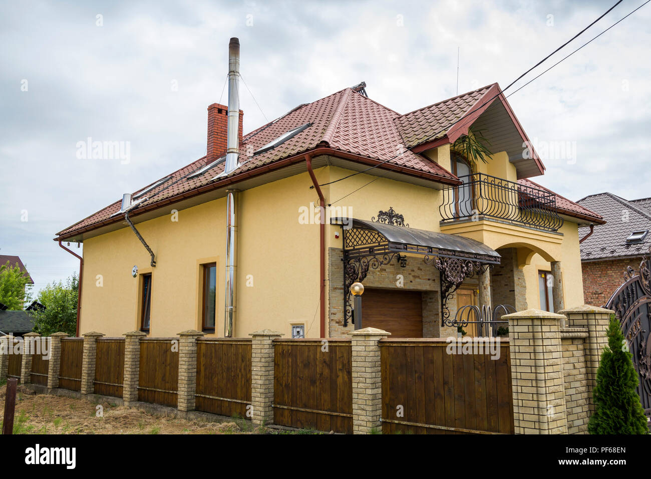 Two story yellow house porch hi-res stock photography and images - Alamy