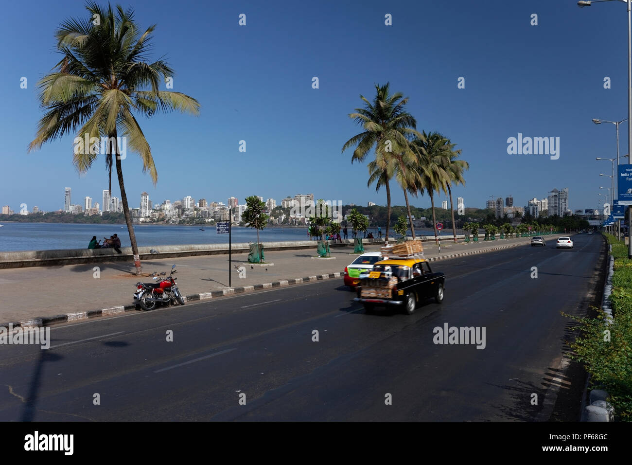 Skyline showing Walkeshwar area and vehicle traffic at marine drive in ...