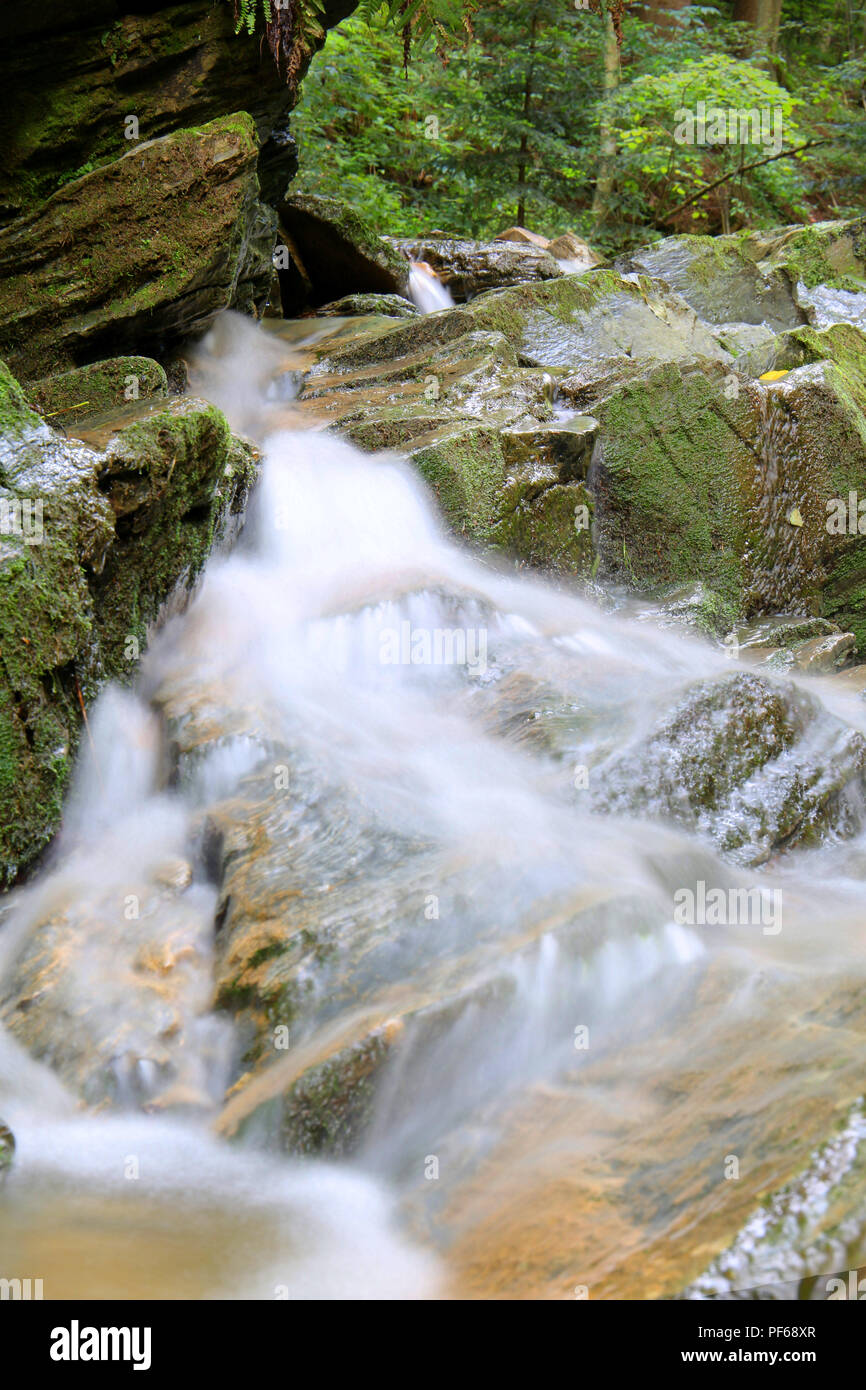 A river flowing over rocks Stock Photo - Alamy