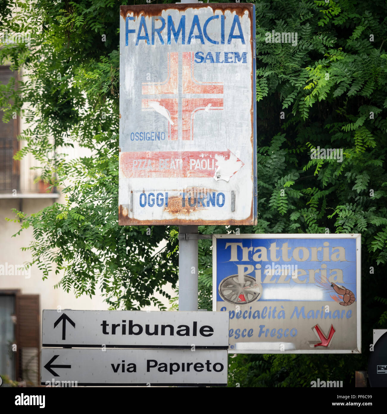 PALERMO, SICILY, ITALY - MAY 21, 2018: Colourful old signs on post ...