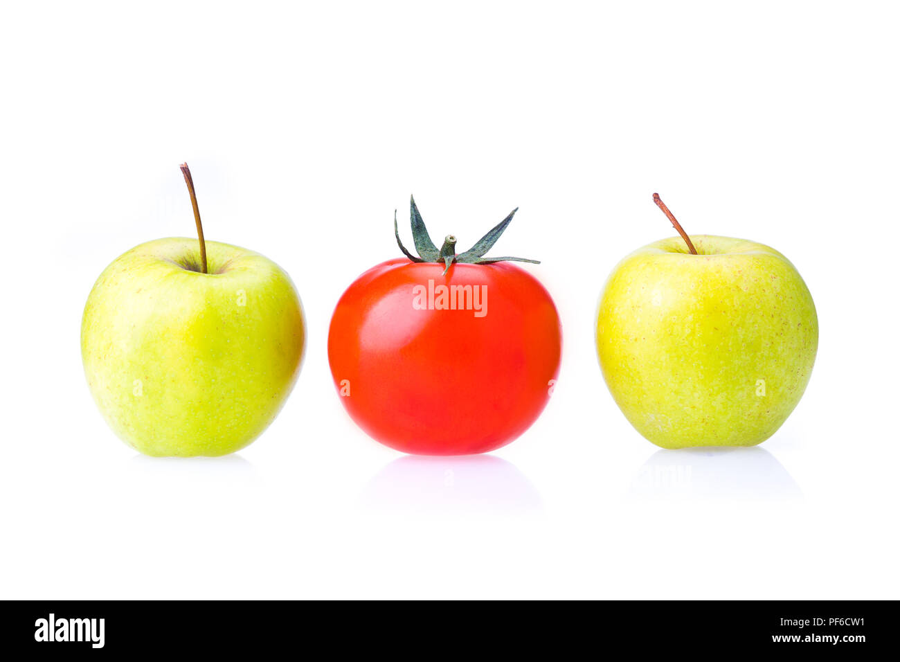 two green Apple, tomato isolated white background Stock Photo - Alamy