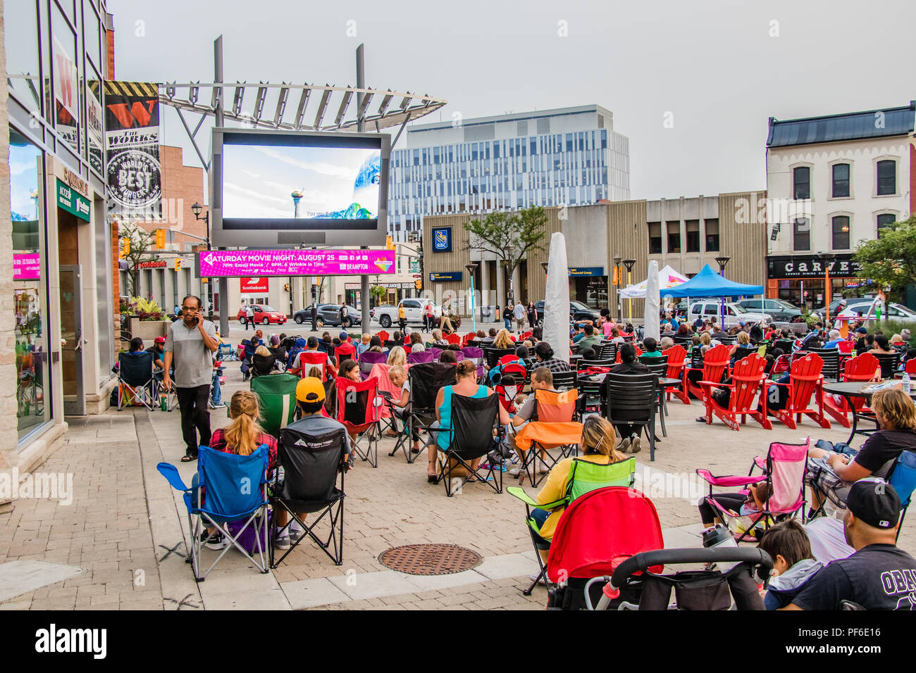 People Watching A Movie Outside