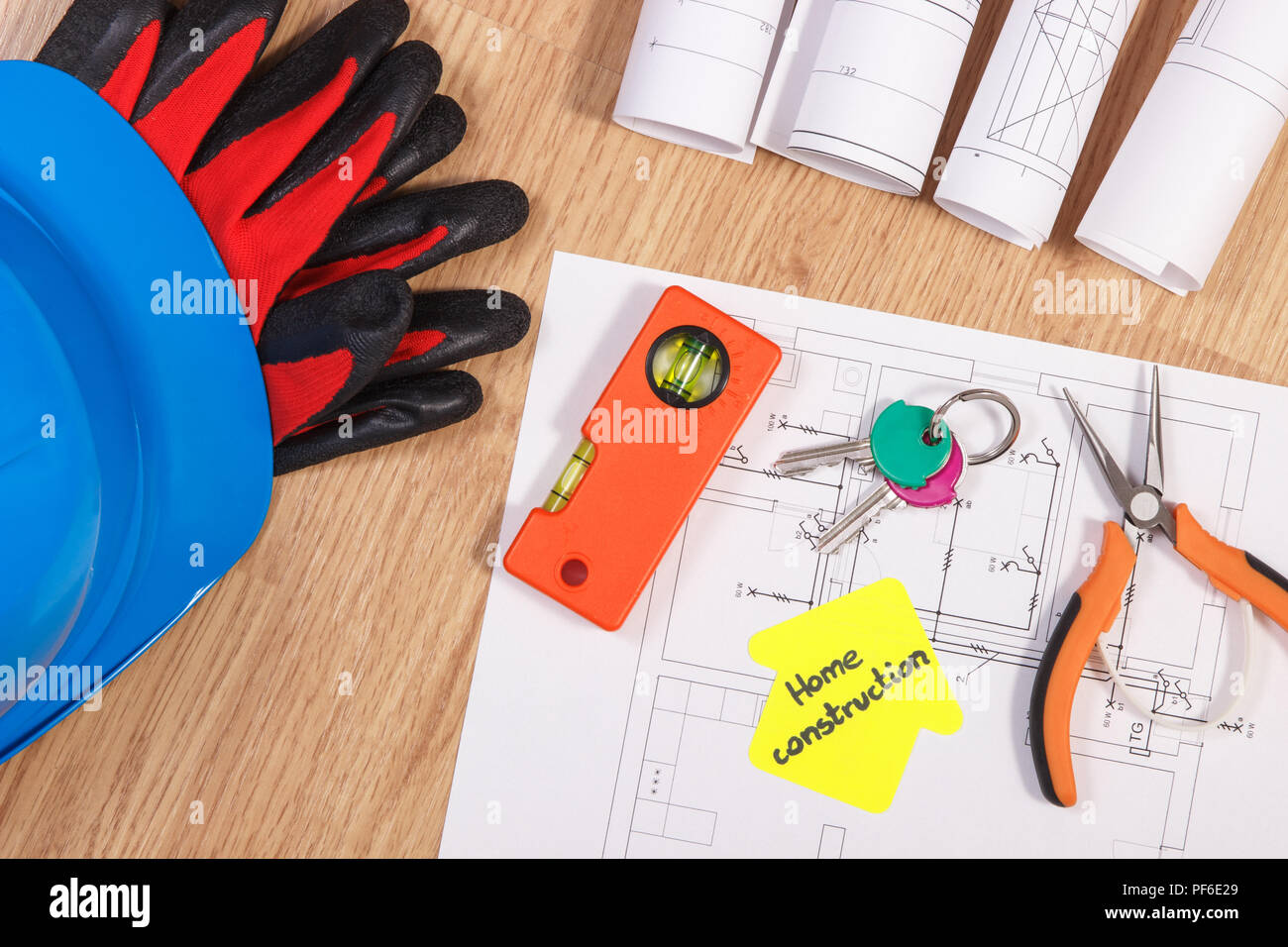 House shape with text home construction, keys, electrical diagrams and ...
