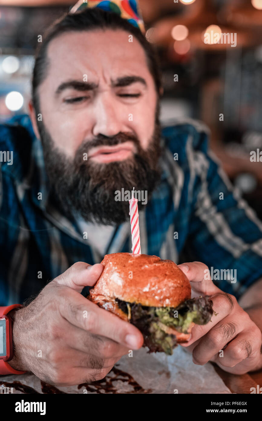 Bearded man eating burger in hi-res stock photography and images - Alamy