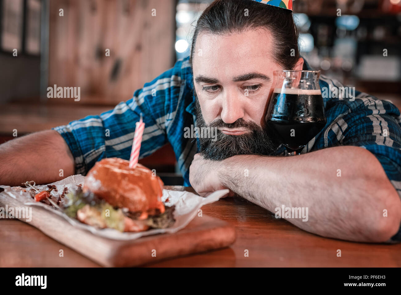 Lonely businessman spending night in the meat restaurant Stock Photo ...