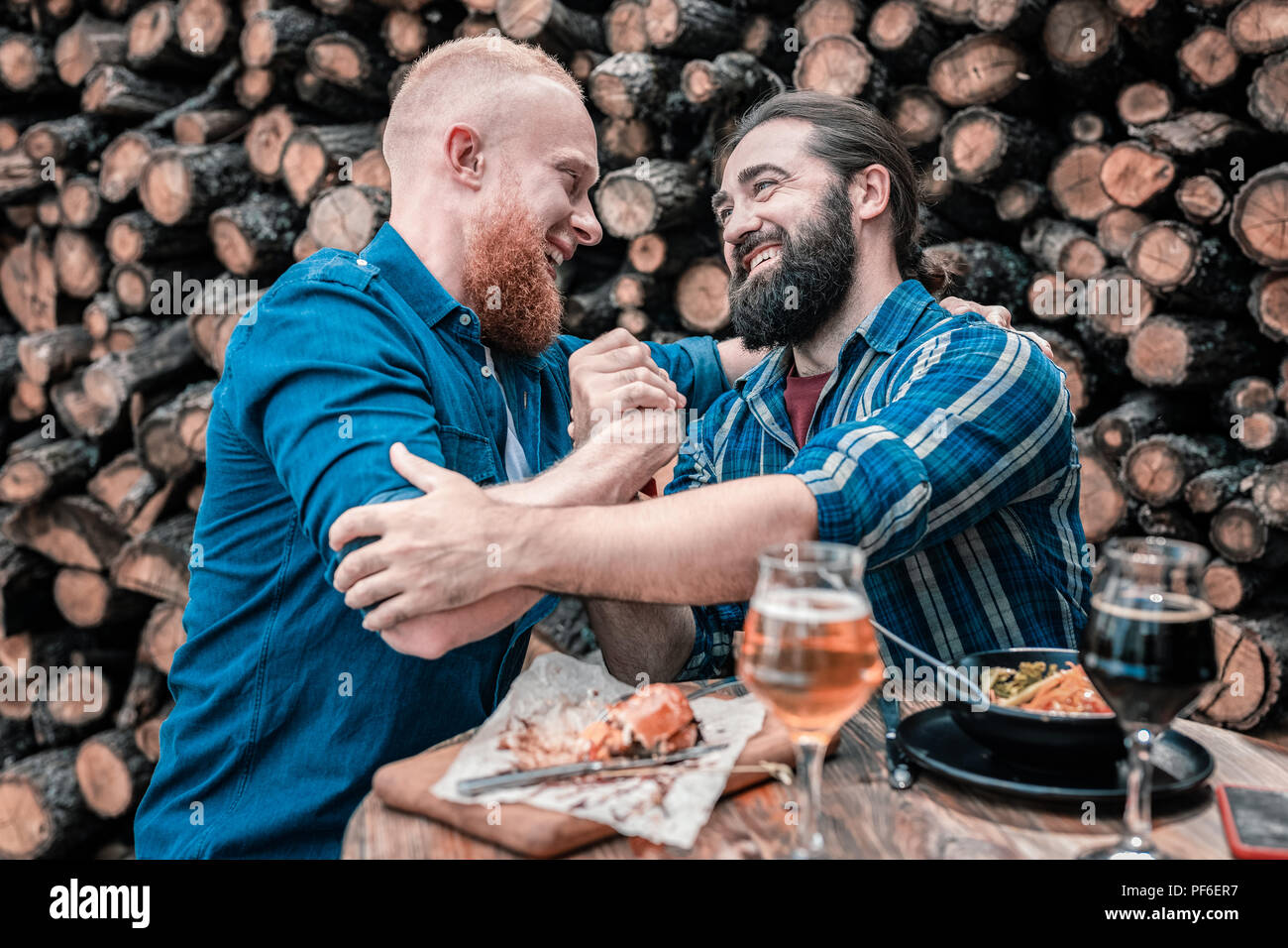 Best friends shaking their hand while meeting in the pub Stock Photo ...