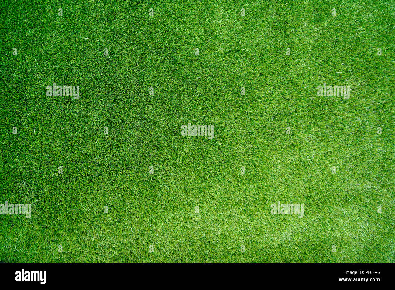 artificial grass field background Stock Photo - Alamy