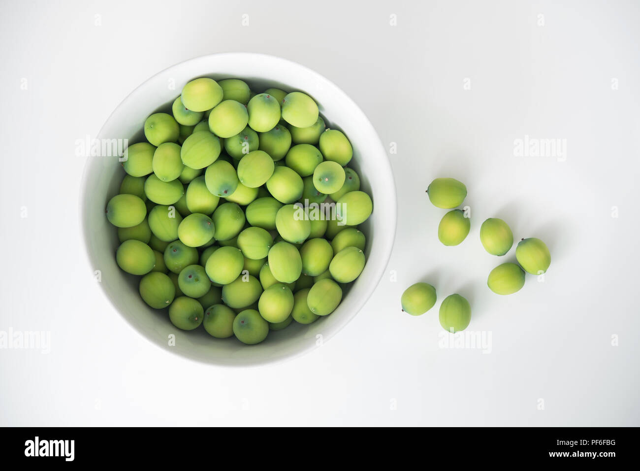 fresh lotus seeds in a cup isolated on white background Stock Photo - Alamy