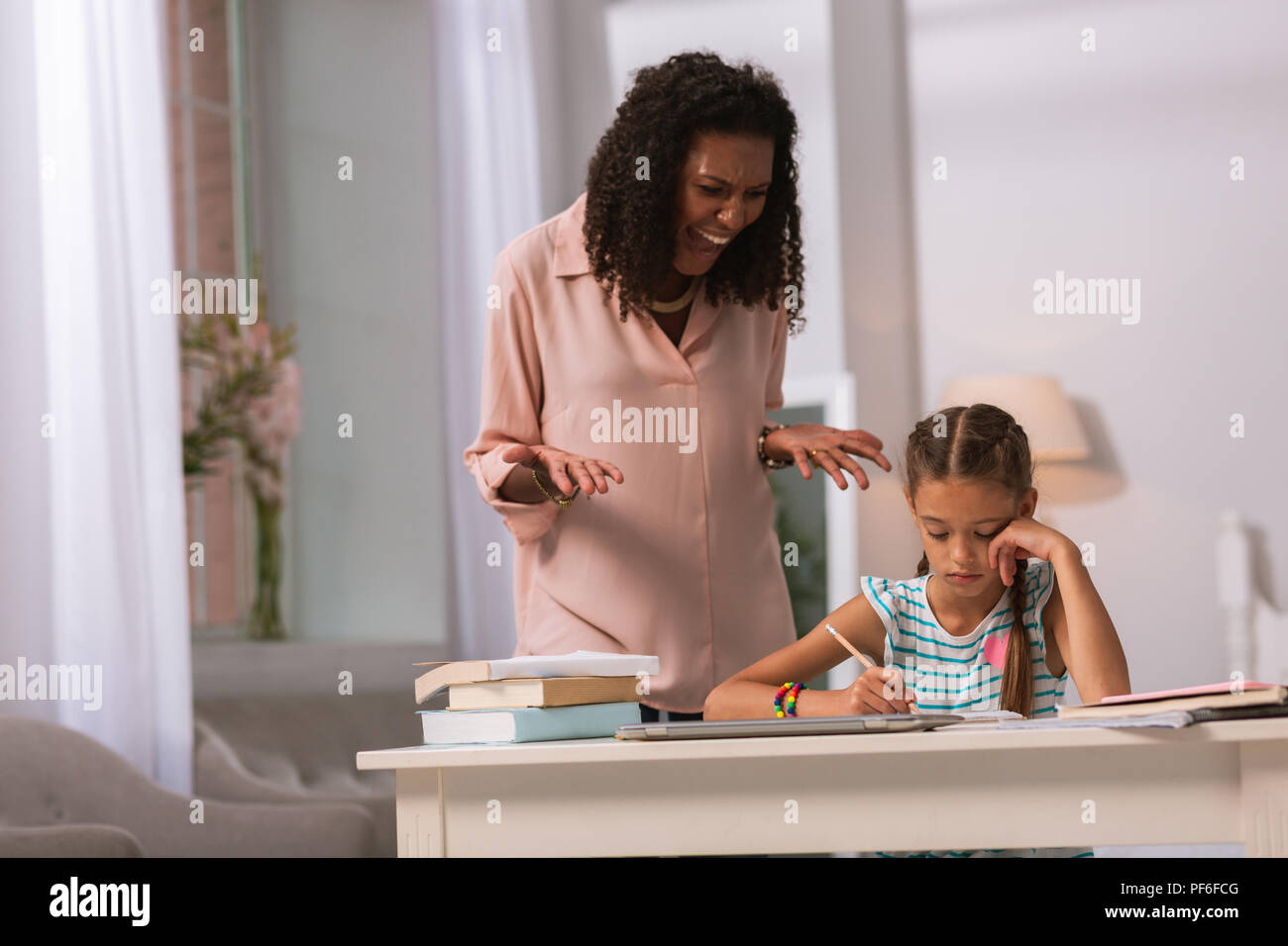 Unhappy angry woman shouting at her daughter Stock Photo - Alamy