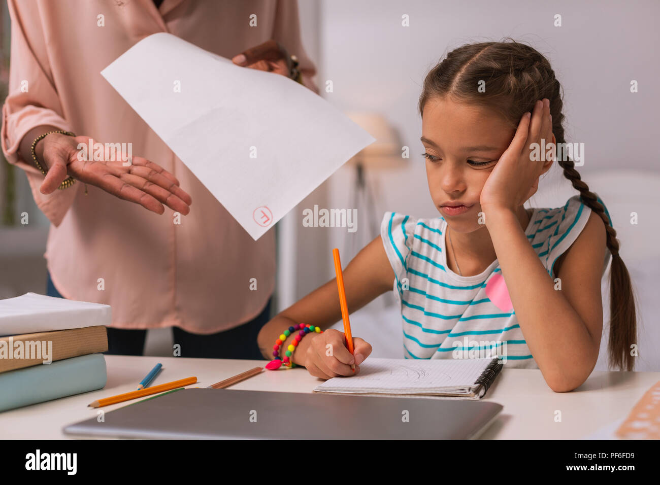 Cheerless bored girl listening to her mother Stock Photo - Alamy