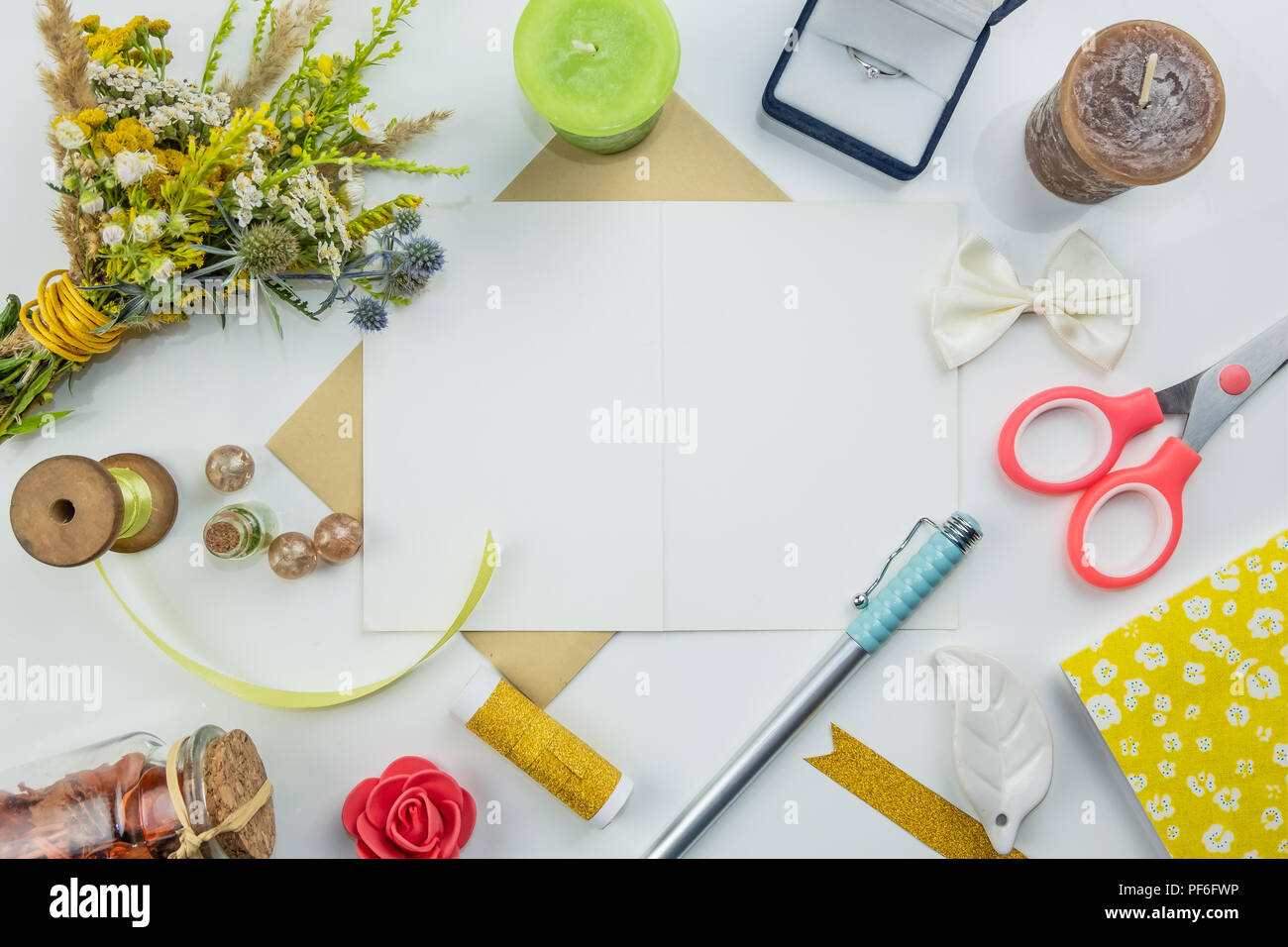 Flat lay of open postcard with empty space for slogan or invitation for ...